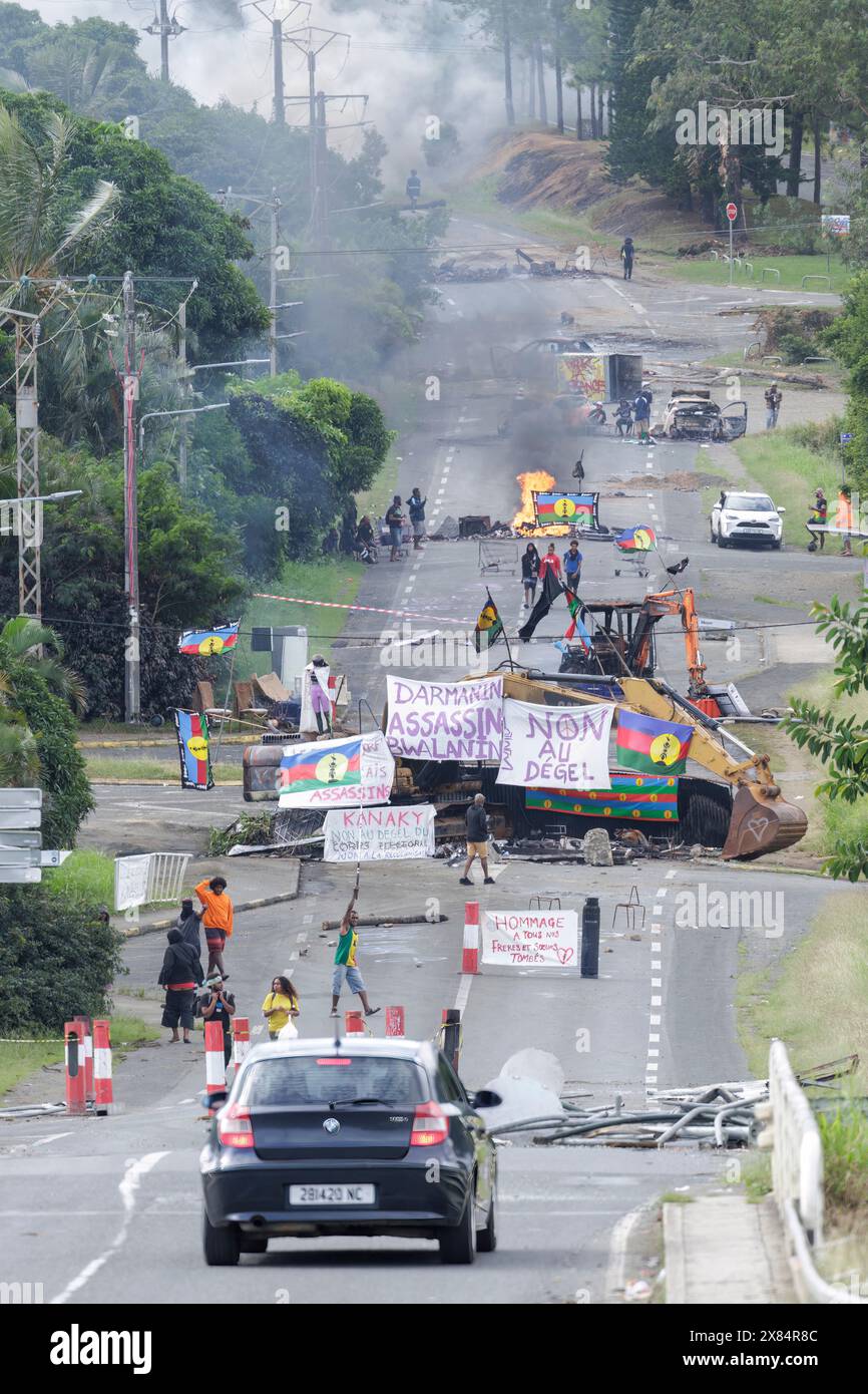 Noumea, France. 23rd May, 2024. Protesters wave Kanak flags at an ...
