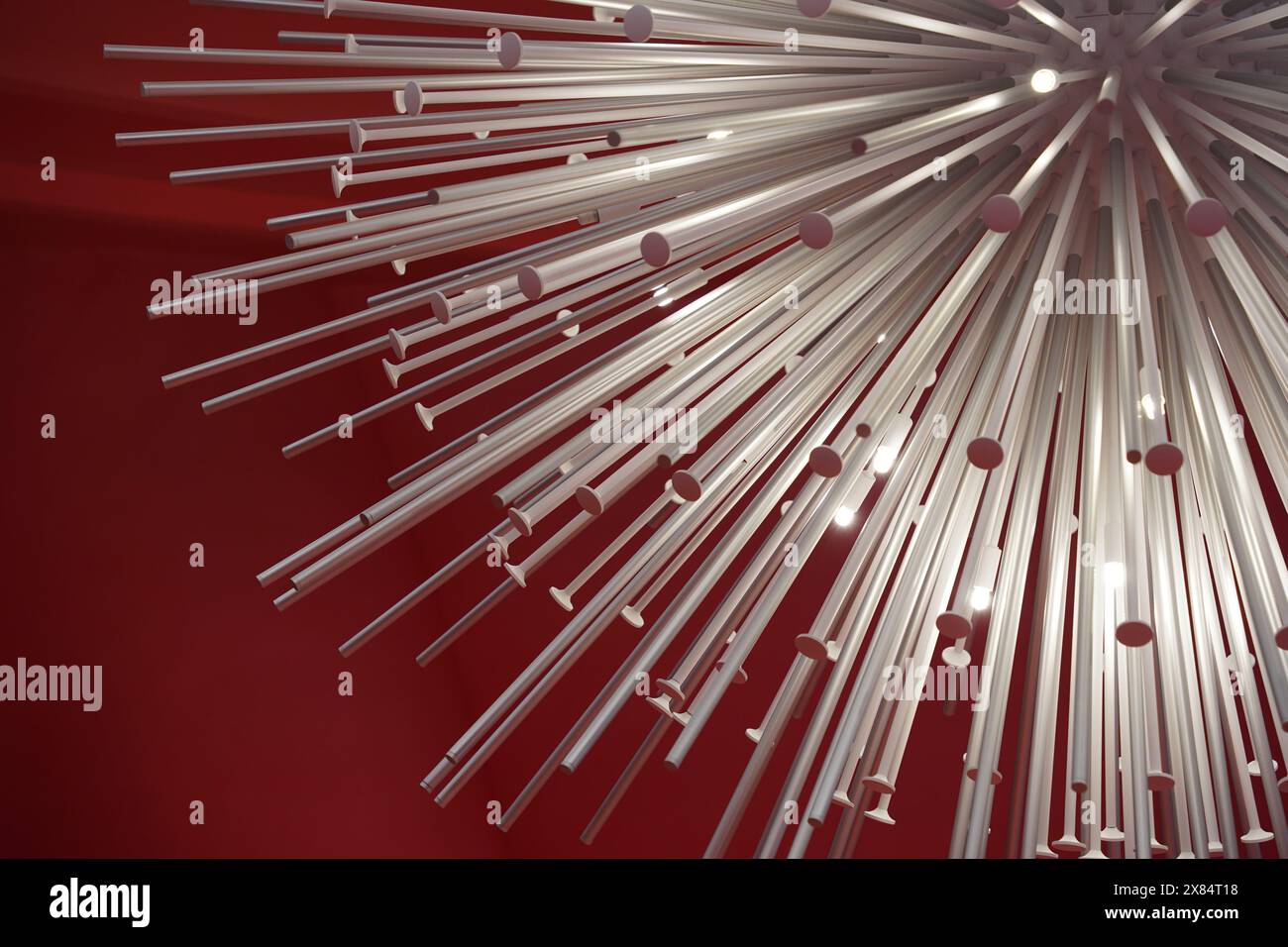 photo of a group of white metal rods on a red background Stock Photo ...