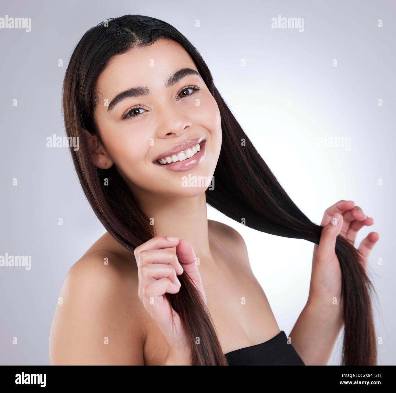 Portrait, happy and woman with hair care by studio backdrop for beauty ...