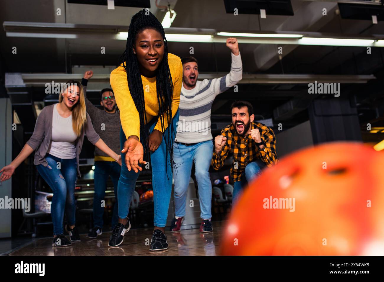 Group of friends enjoying time together laughing and cheering while ...