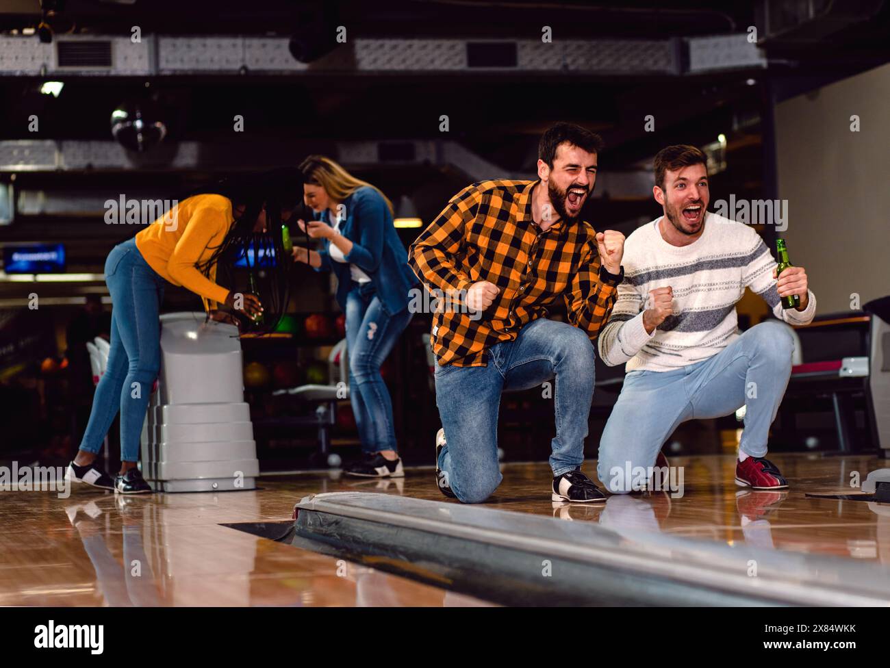 Group of friends enjoying time together laughing and cheering while ...