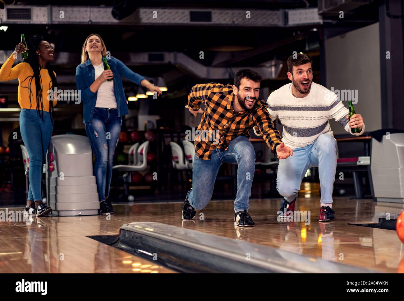 Group of friends enjoying time together laughing and cheering while ...