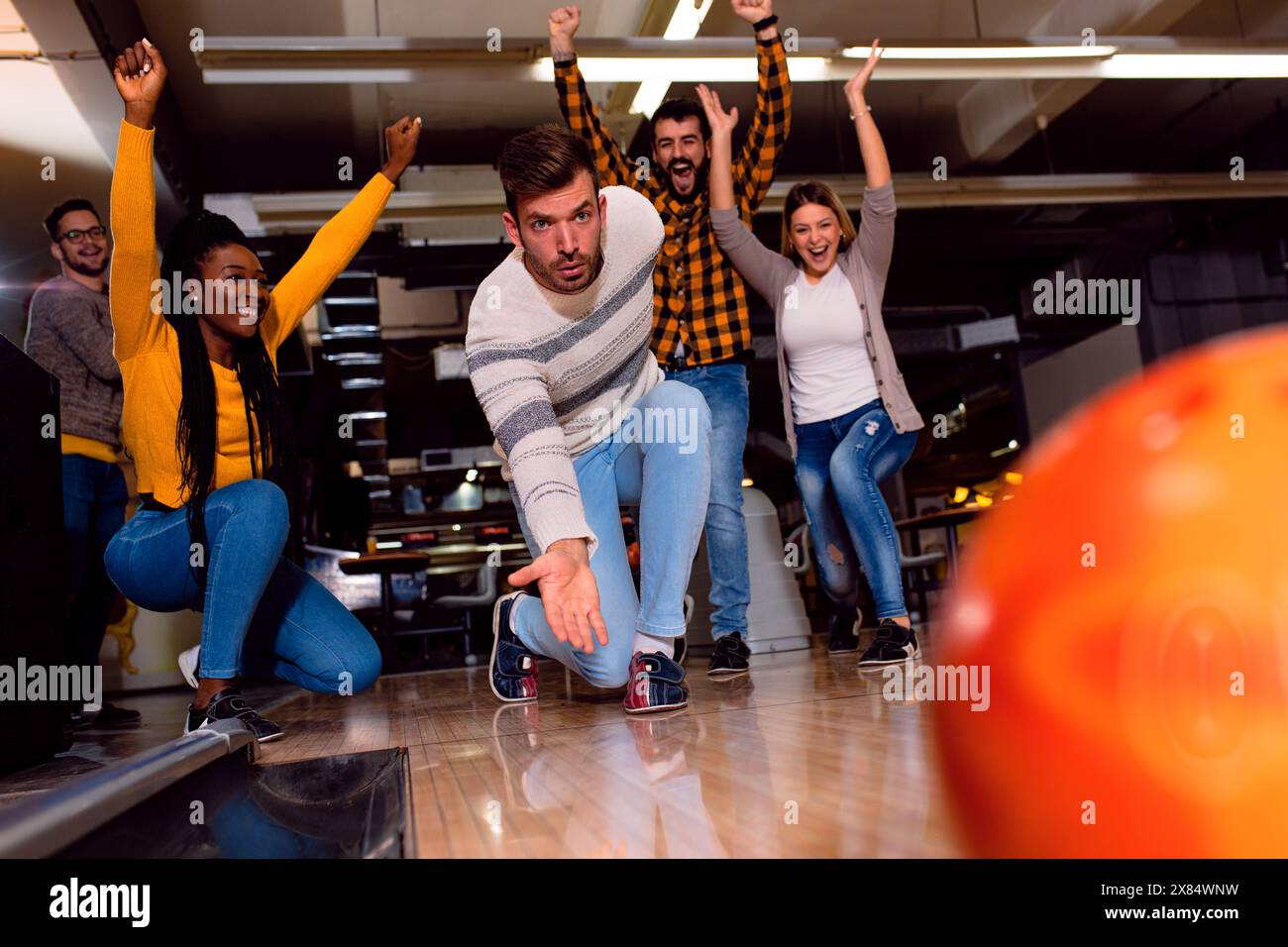 Group of friends enjoying time together laughing and cheering while ...