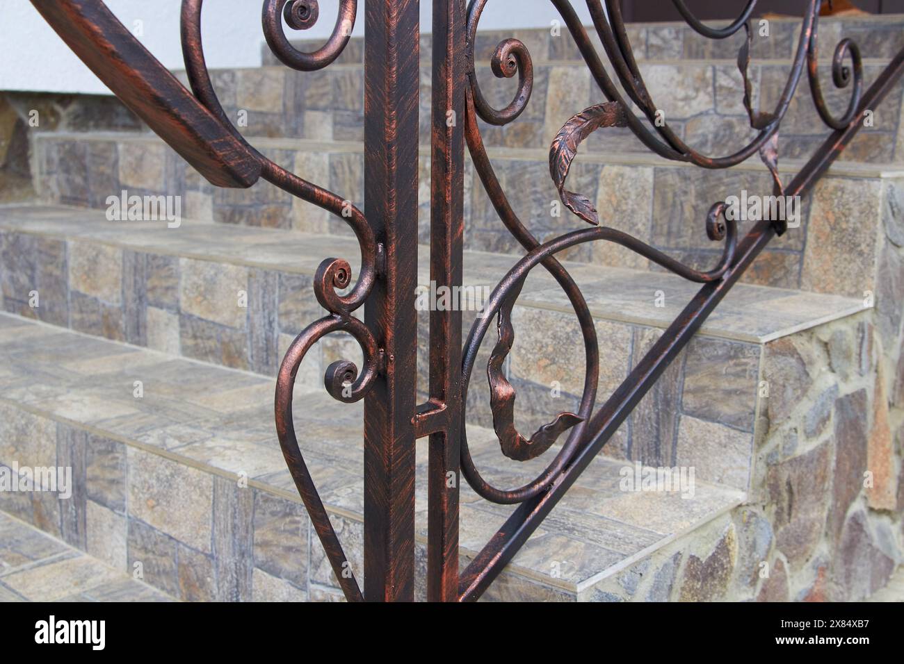 metal forged handrails with a frame on a ceramic tile Stock Photo - Alamy