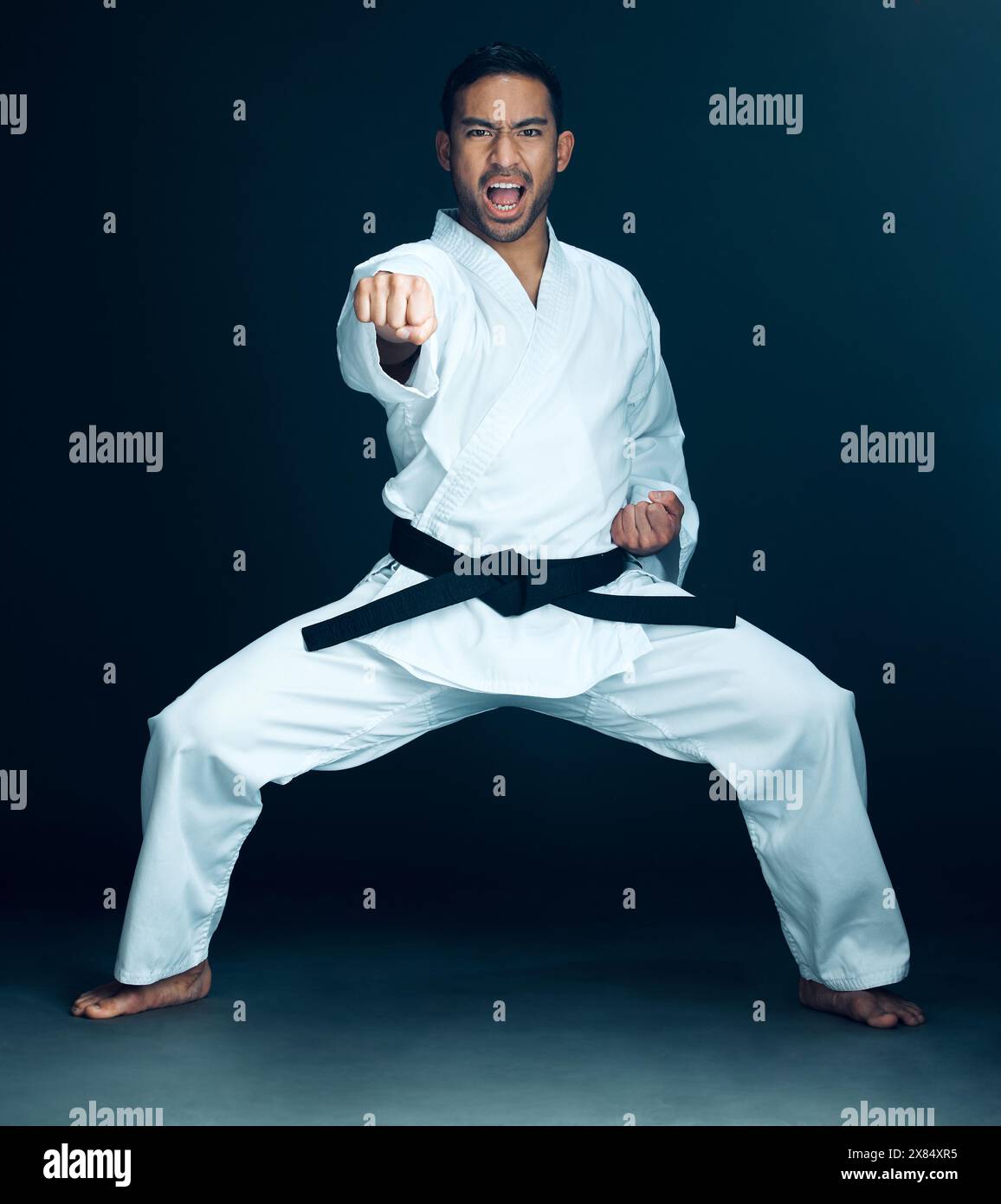 Karate, master and angry portrait of man in studio, black background or ...