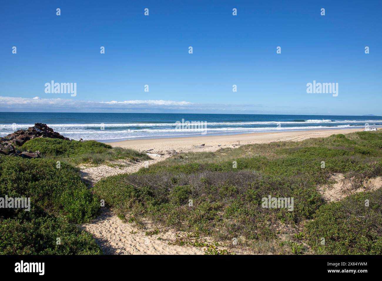 Urunga town on Coffs Harbour coast, view along Hungry head beach viewed ...