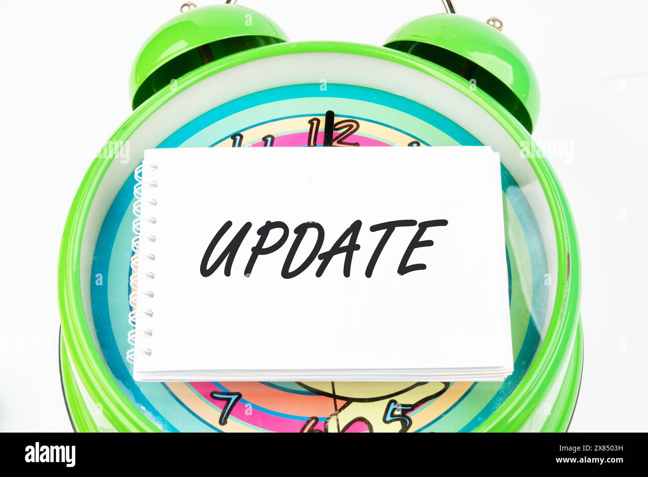 The word UPDATE on a business card on the watch face Stock Photo - Alamy