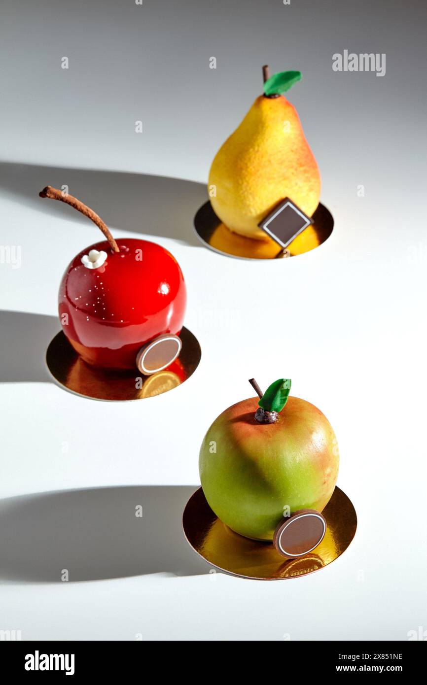 Collection of sweet fruit shaped pastries decorated with chocolate ...