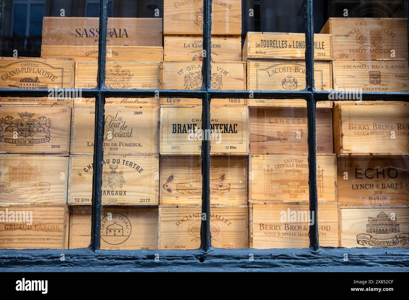 London, UK - February 19th 2024: Crates of wine viewed through the shop ...