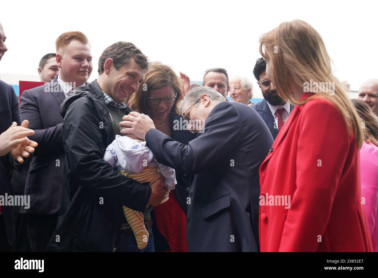 Labour Party leader Sir Keir Starmer meets a baby during a visit to ...