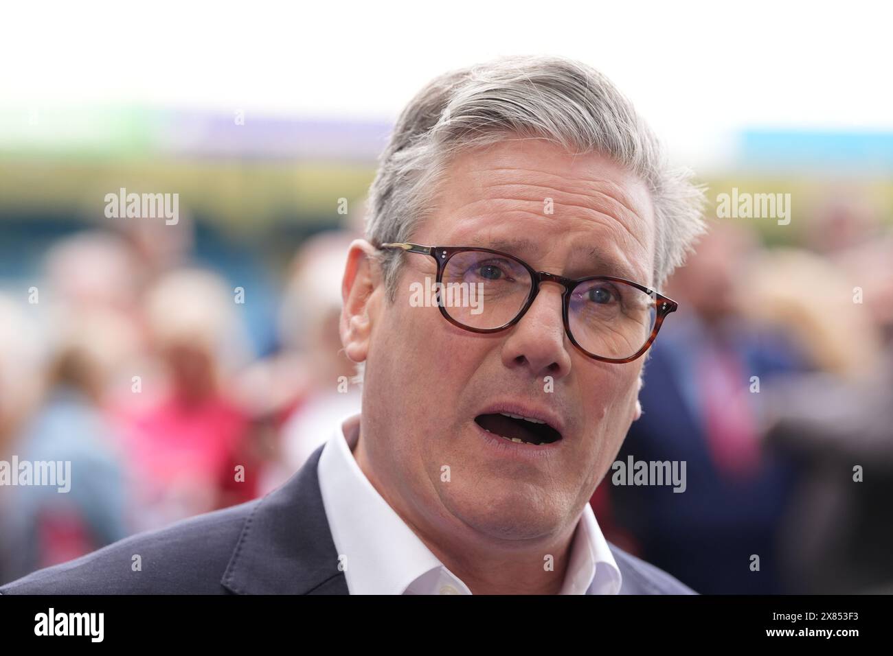 Labour Party leader Sir Keir Starmer meets a baby during a visit to ...