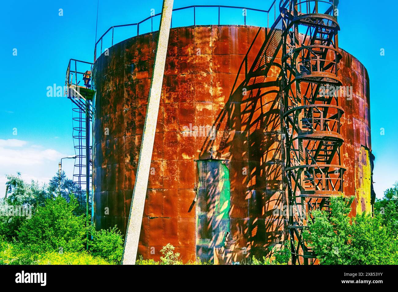 Old rusty oil tanks (fuel reservoir, oil barrel). Evidence of economic ...