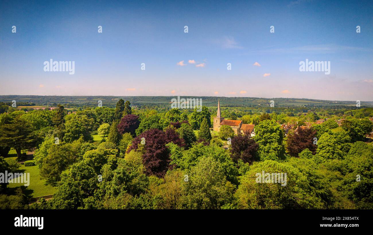 West Malling Church surrounded by woods and trees in full bloom with ...