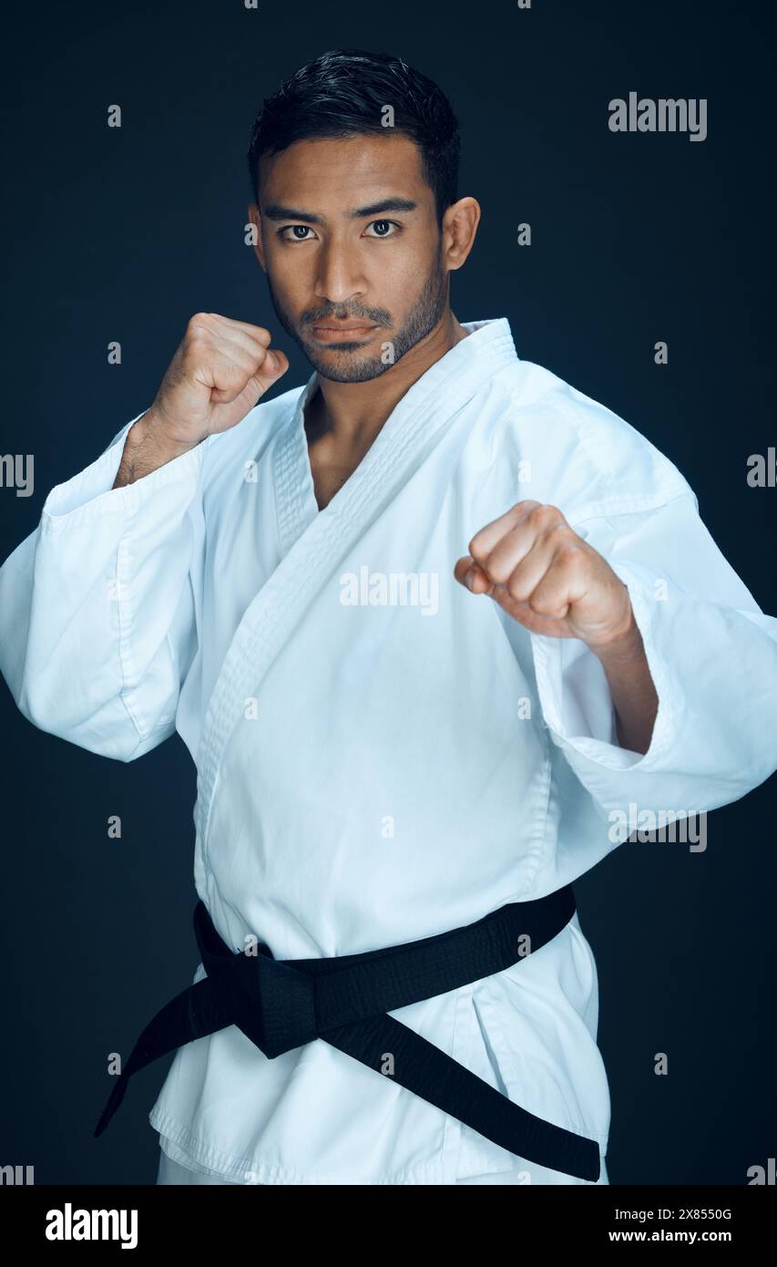 Karate, master and martial arts portrait of man in studio, black ...