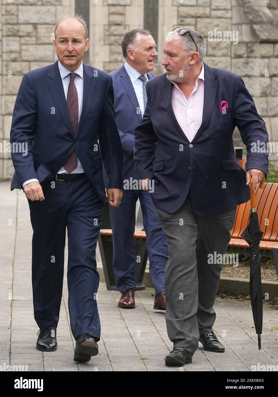 Tanaiste Micheal Martin (left) arrives for the funeral of businessman ...
