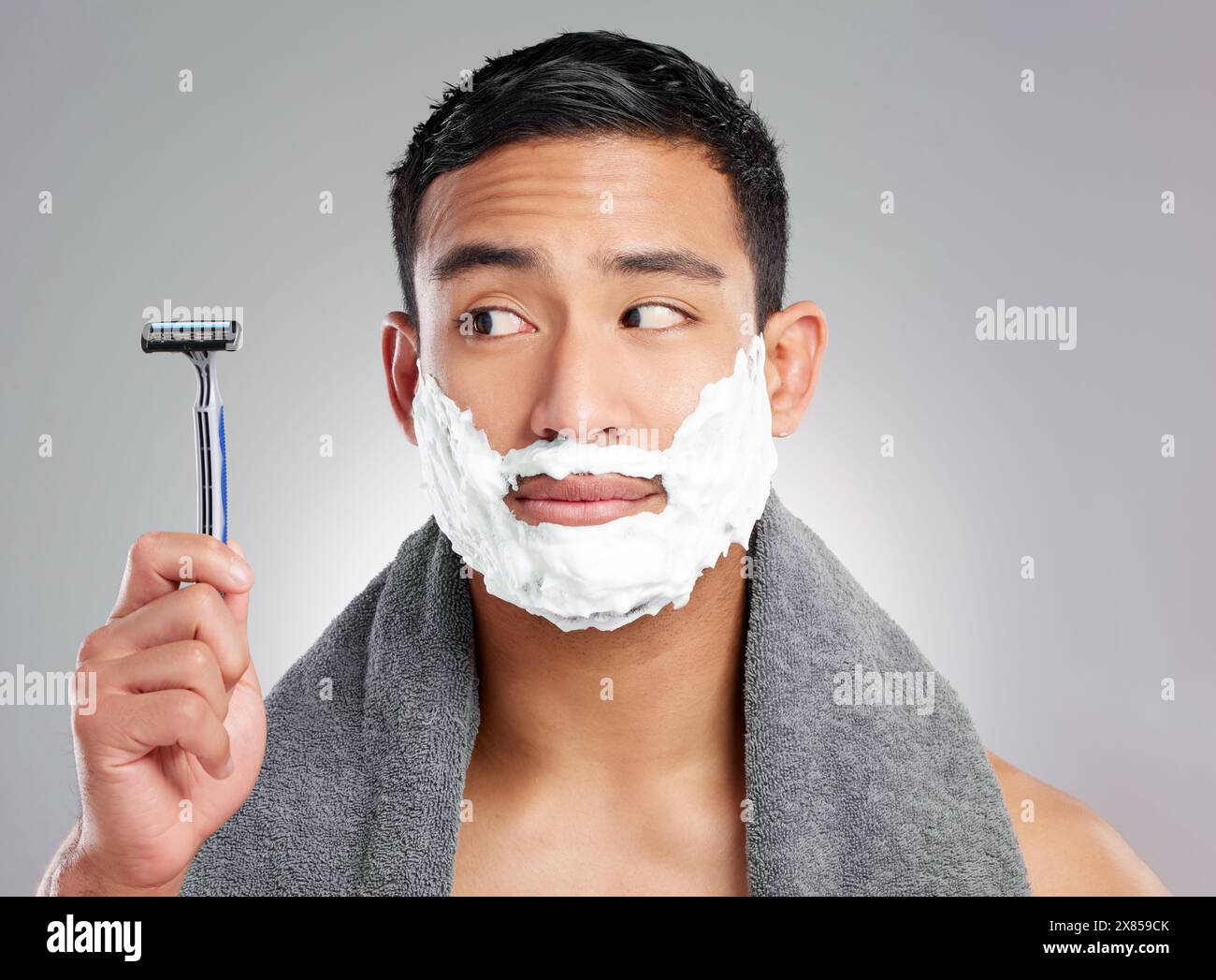 Asian man, razor and beard with shaving cream or hair removal grooming, cleaning or grey ...