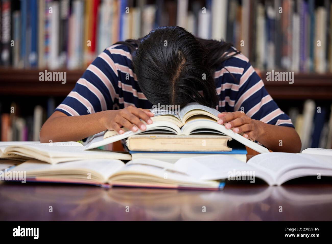 Student, sleeping and library with woman, burnout and course research ...