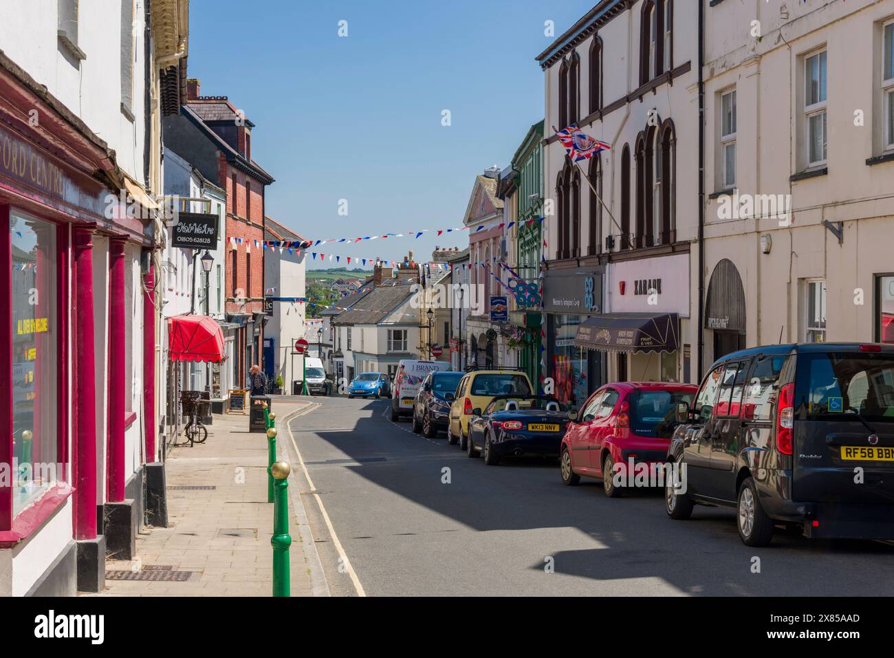 Shops and parked cars along South Street in the market town of Great ...