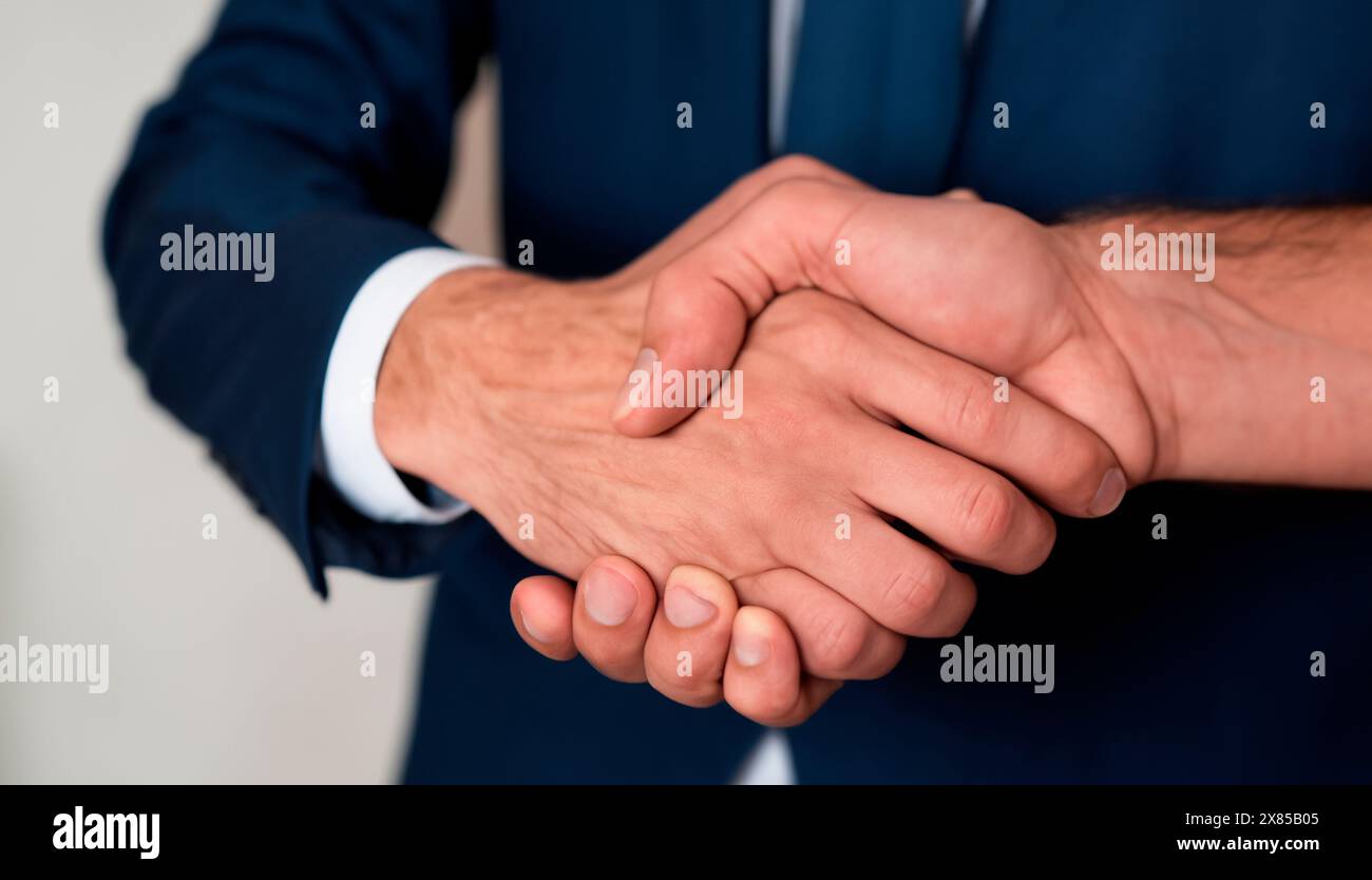 Two men shake hands. Close-up of shaking hands Stock Photo - Alamy
