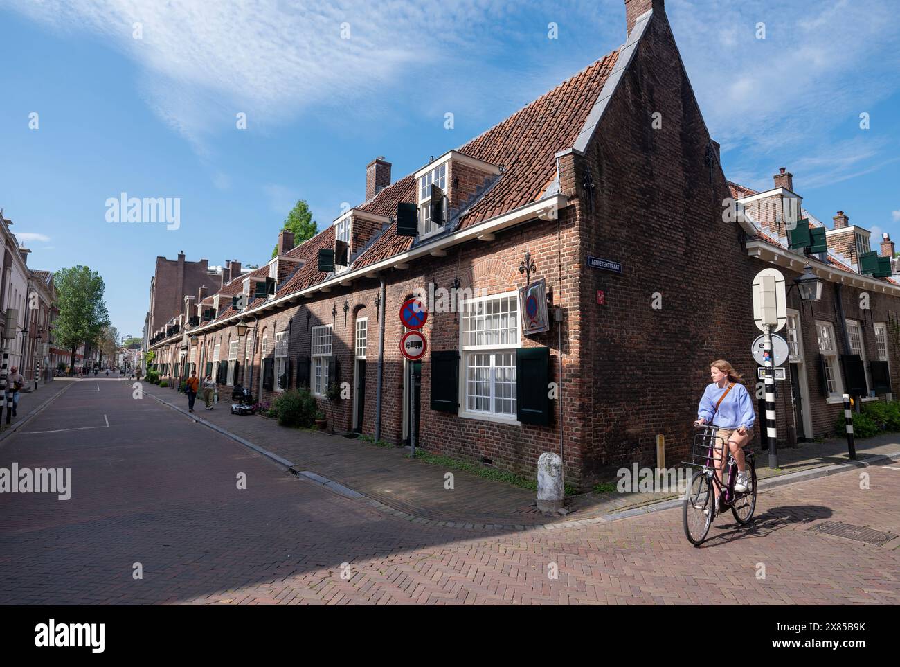 utrecht, netherlands, 19 may 2024: girl on bicycle passes very old ...