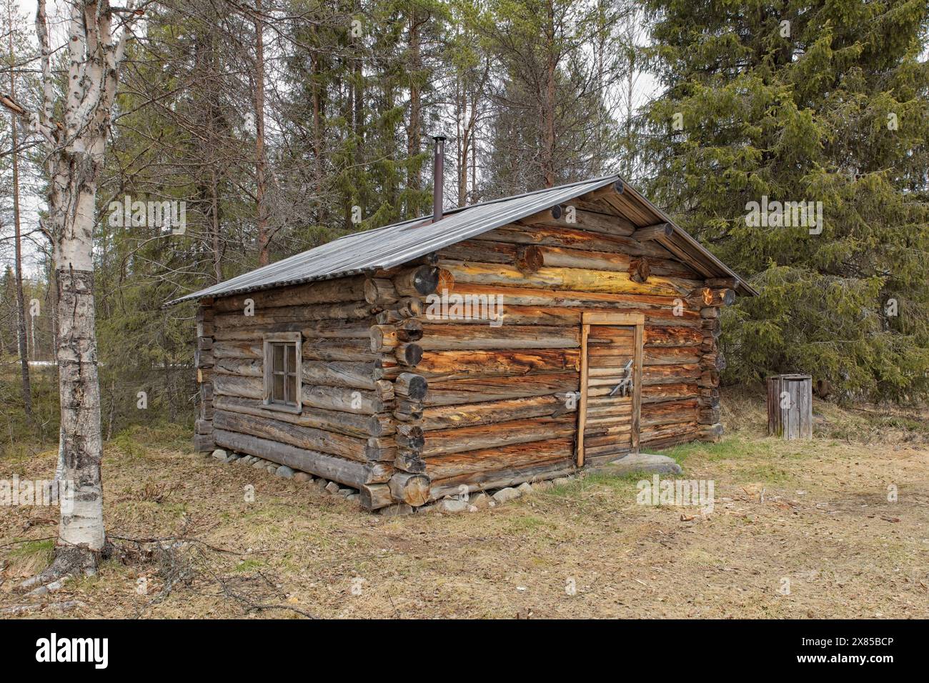 Old log cabin in cloudy spring weather at Riutukka Log Floating Museum ...