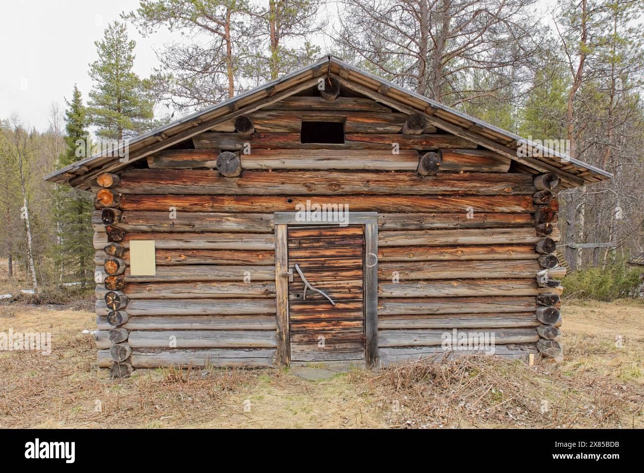 Old log cabin in cloudy spring weather at Riutukka Log Floating Museum ...