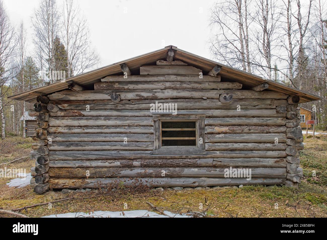 Old log cabin in cloudy spring weather at Riutukka Log Floating Museum ...