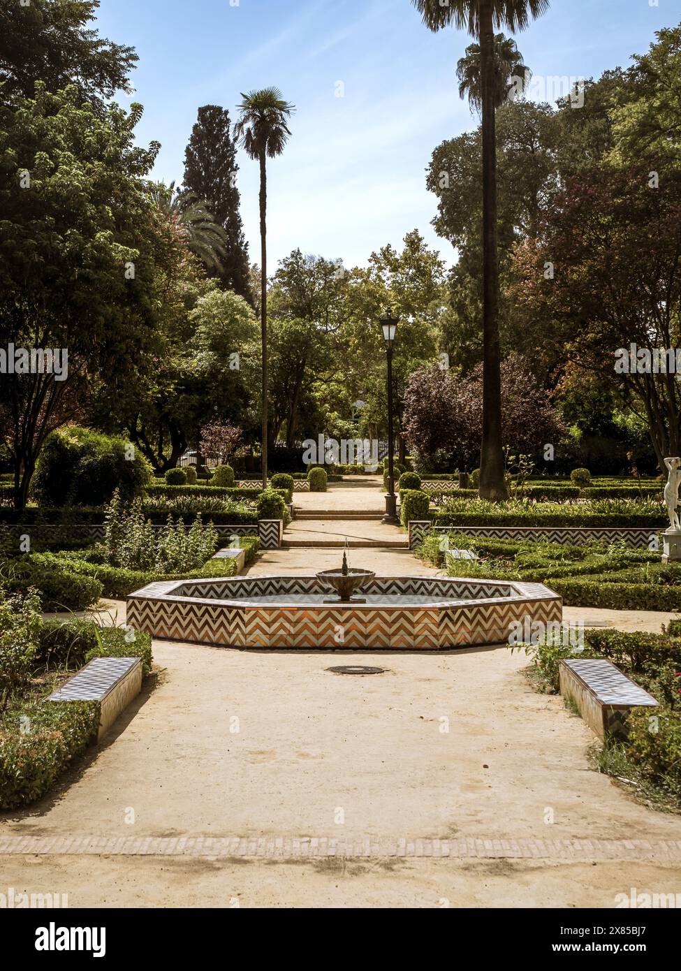 A tiled water fountain in the park named Parque Maria Luisa in Seville ...