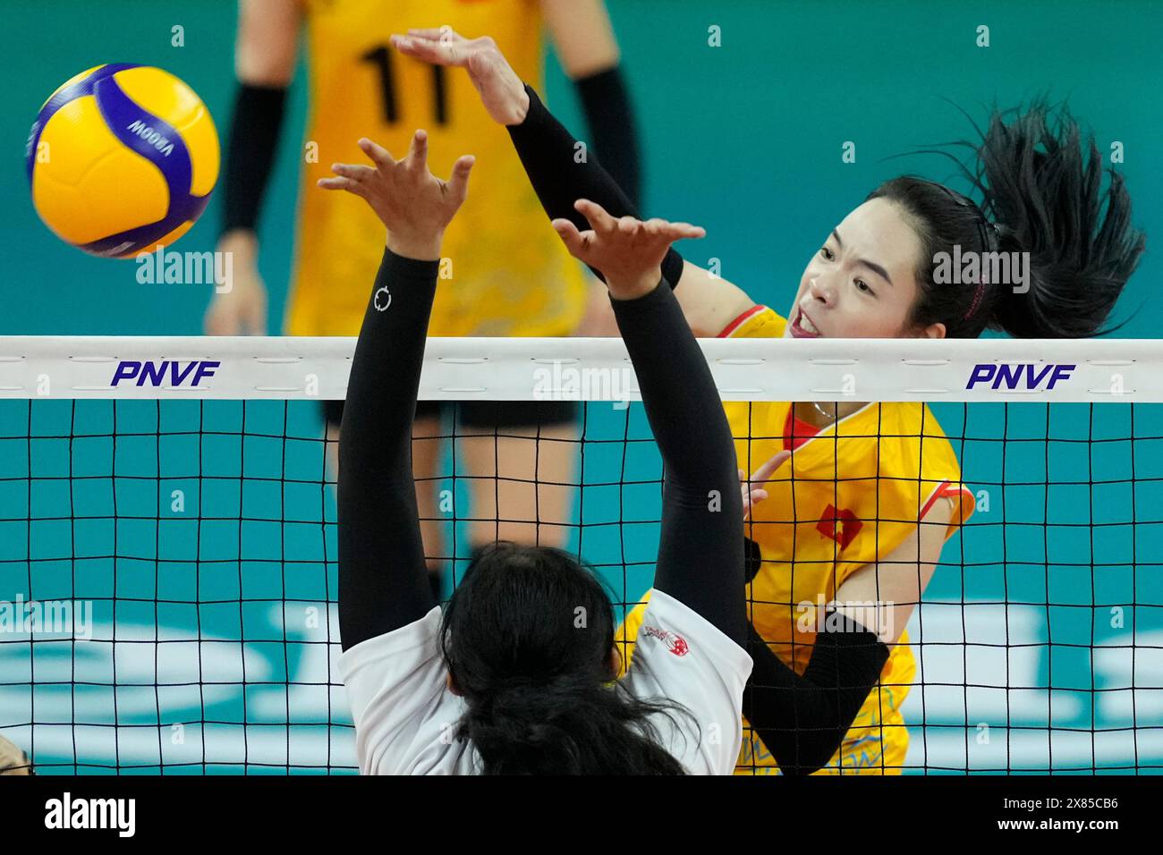 Vietnam's Thanh Thuy Le, right, hits the ball against Singapore's Sofi ...