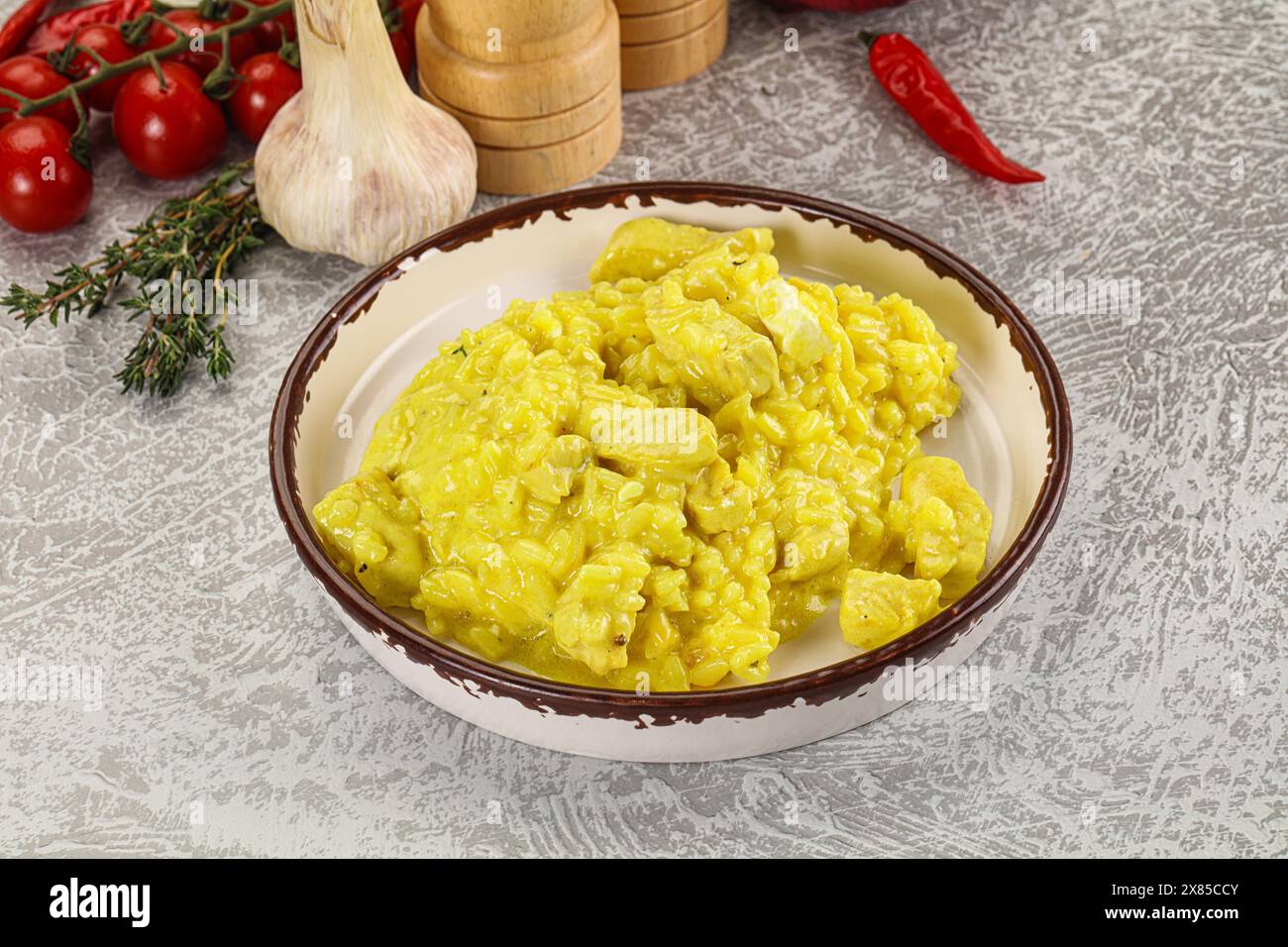 Italian cuisine - yellow risotto with chicken and soft cheese Stock ...