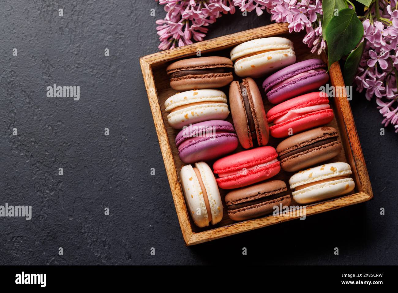 Colorful macaroons in box, arranged in a delightful display of vibrant ...