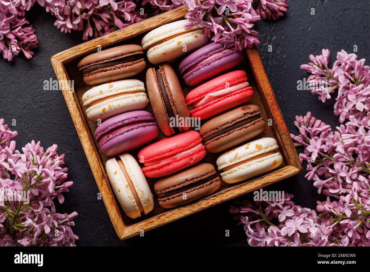 Colorful macaroons in box, arranged in a delightful display of vibrant ...