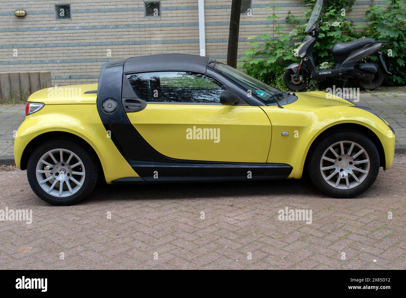 A Yellow Smart Car At Amsterdam The Netherlands 20-5-2024 Stock Photo ...