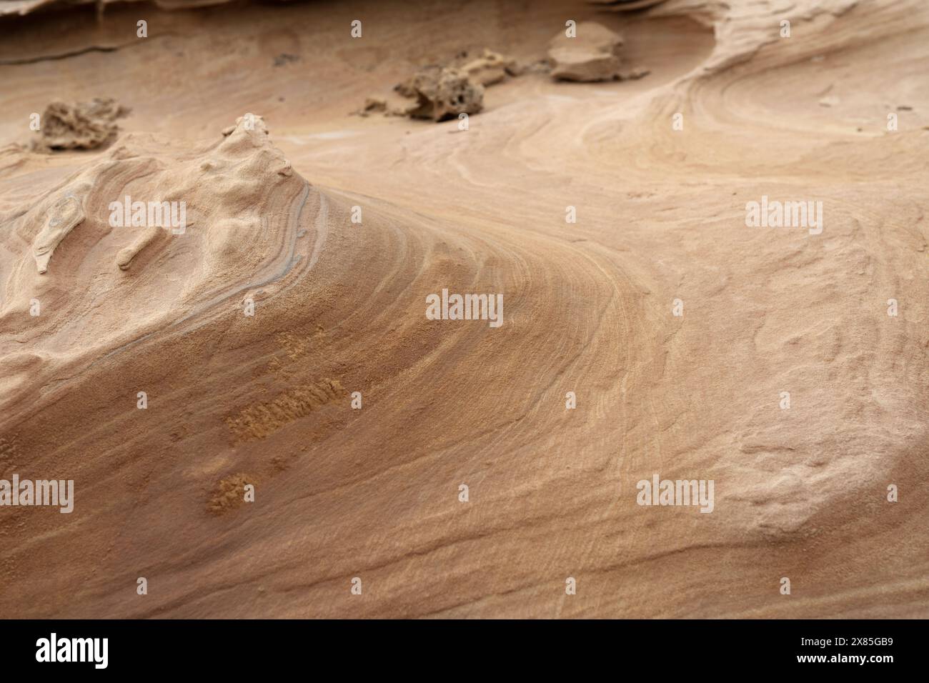 Close-up of intricate sandstone swirls and erosion patterns ...