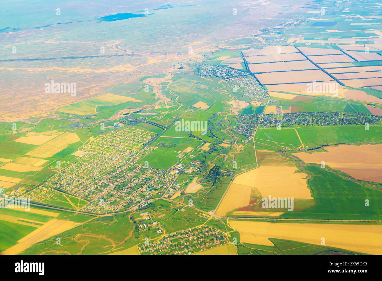 Beautiful view from the airplane window of the fields and villages in ...