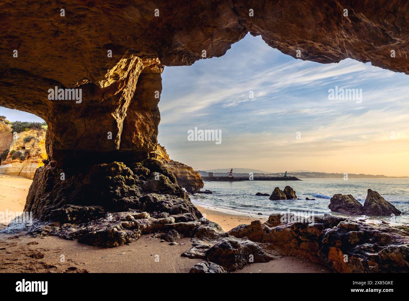 View of Lagos marina entrance at sunrise from the rocky coastline at ...