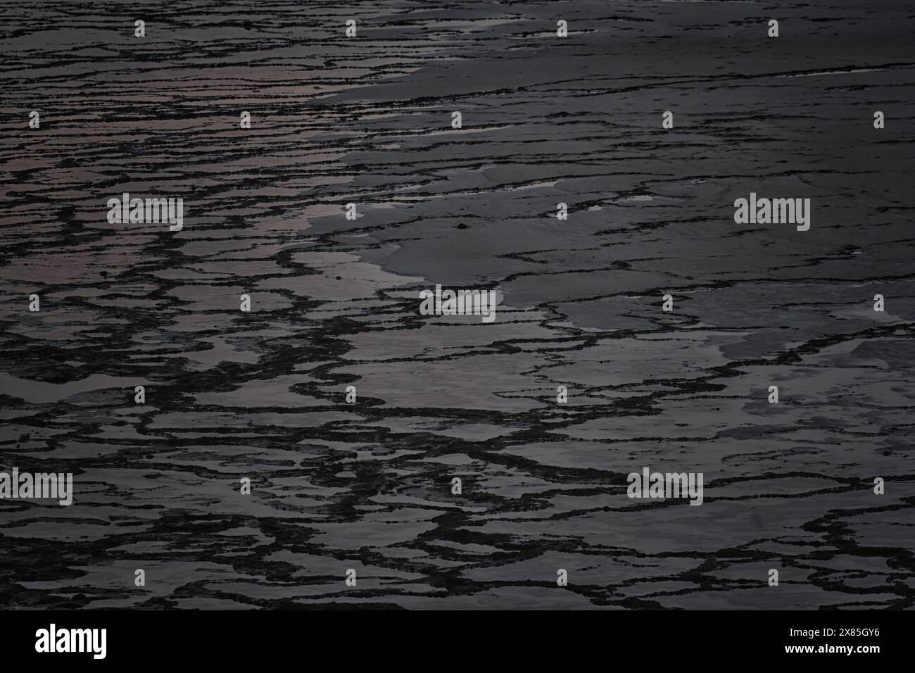 Intricate tide patterns and sand textures created by the ebbing water ...