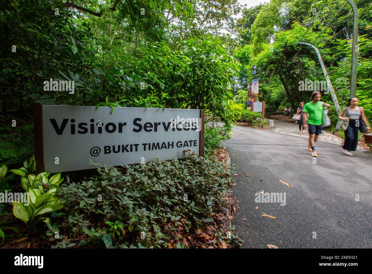 May 2024. Visitor Services at Bukit Timah Gate with three people walking along the route ...