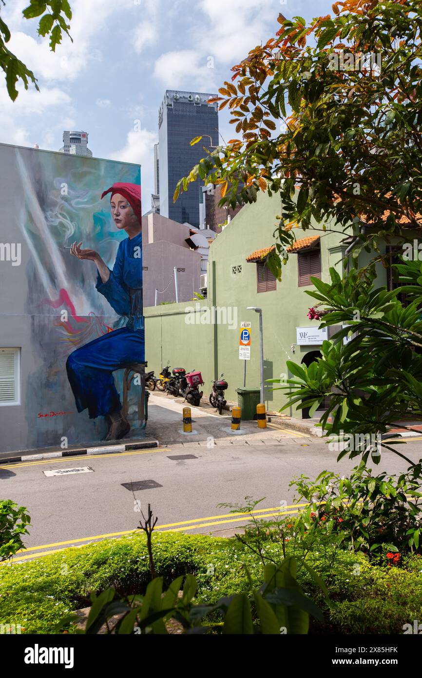 May 2024. Vertical scene. Freshly painted wall mural of Samsui woman on ...