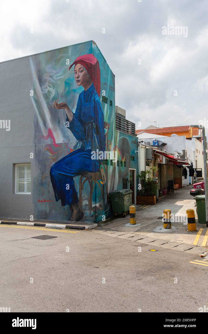 May 2024. Vertical scene. Freshly painted wall mural of Samsui woman on ...