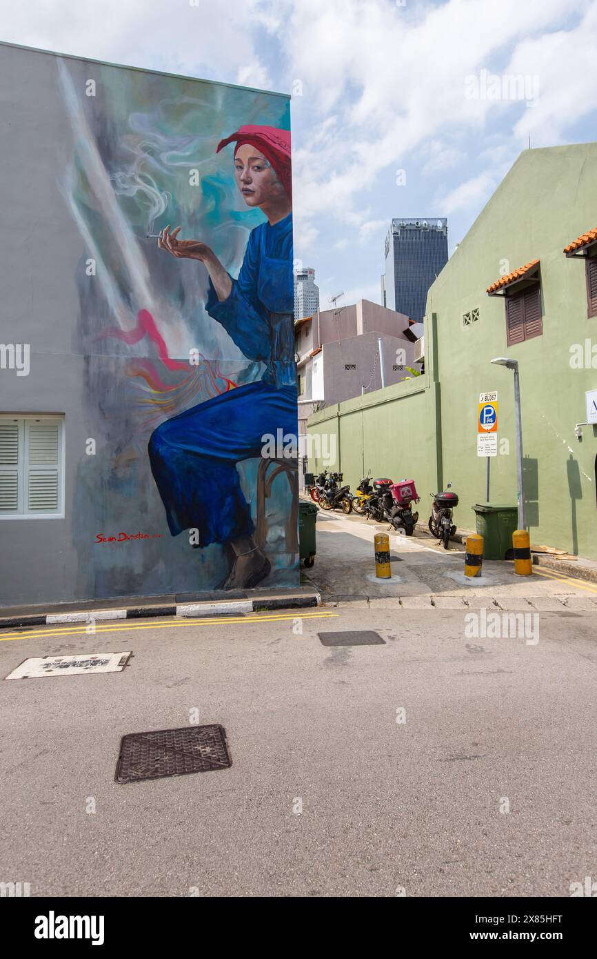 May 2024. Vertical scene. Freshly painted wall mural of Samsui woman on ...