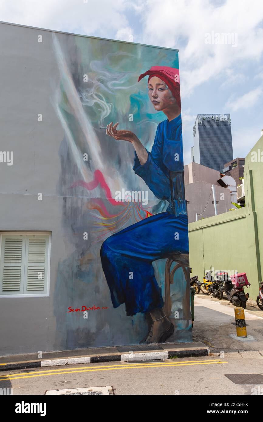 May 2024. Vertical scene. Freshly painted wall mural of Samsui woman on ...