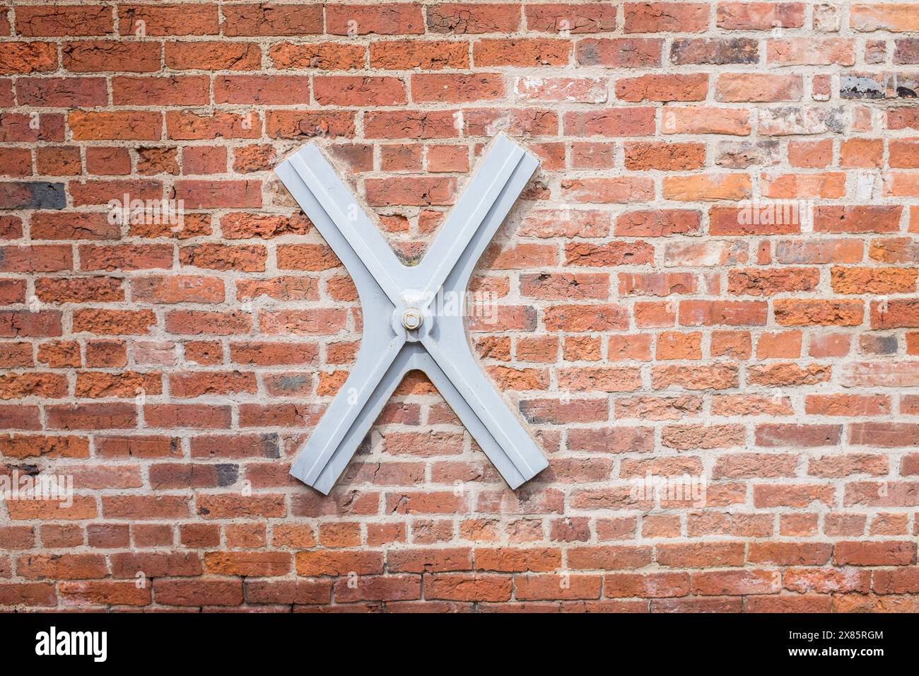Structural wall brace on red brick wall Stock Photo - Alamy