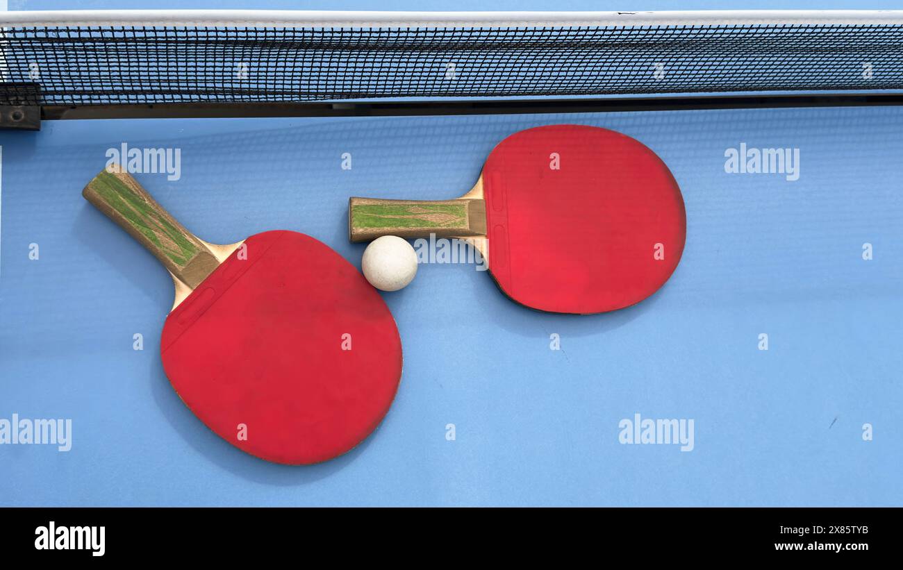 Table tennis rackets and ball on tennis table Stock Photo - Alamy
