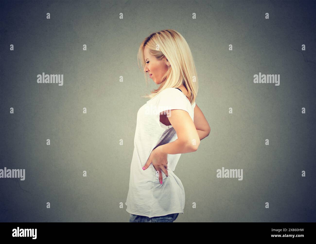 Lady back pain hi-res stock photography and images - Alamy