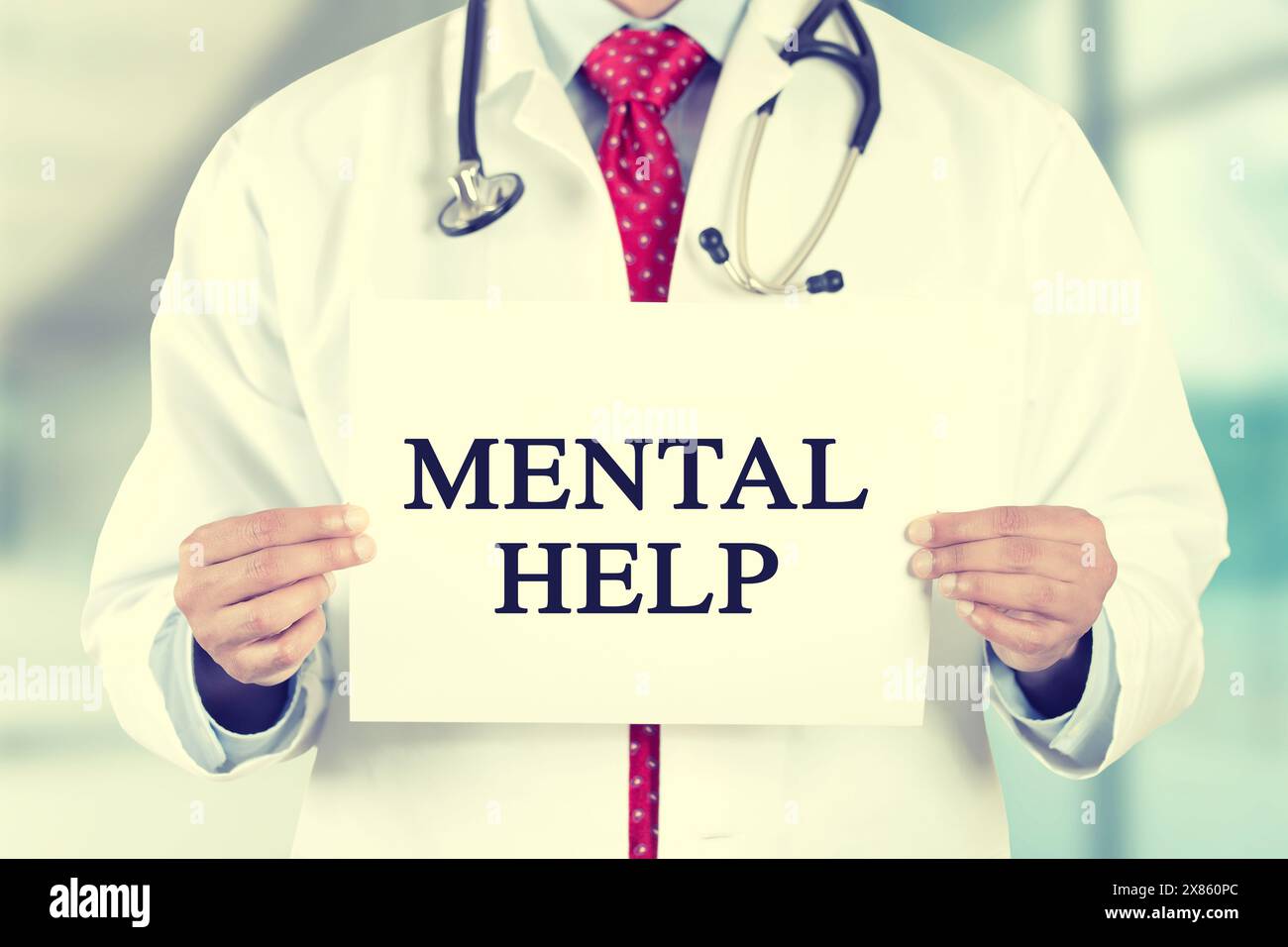 doctor hands holding white card with mental help text message isolated ...