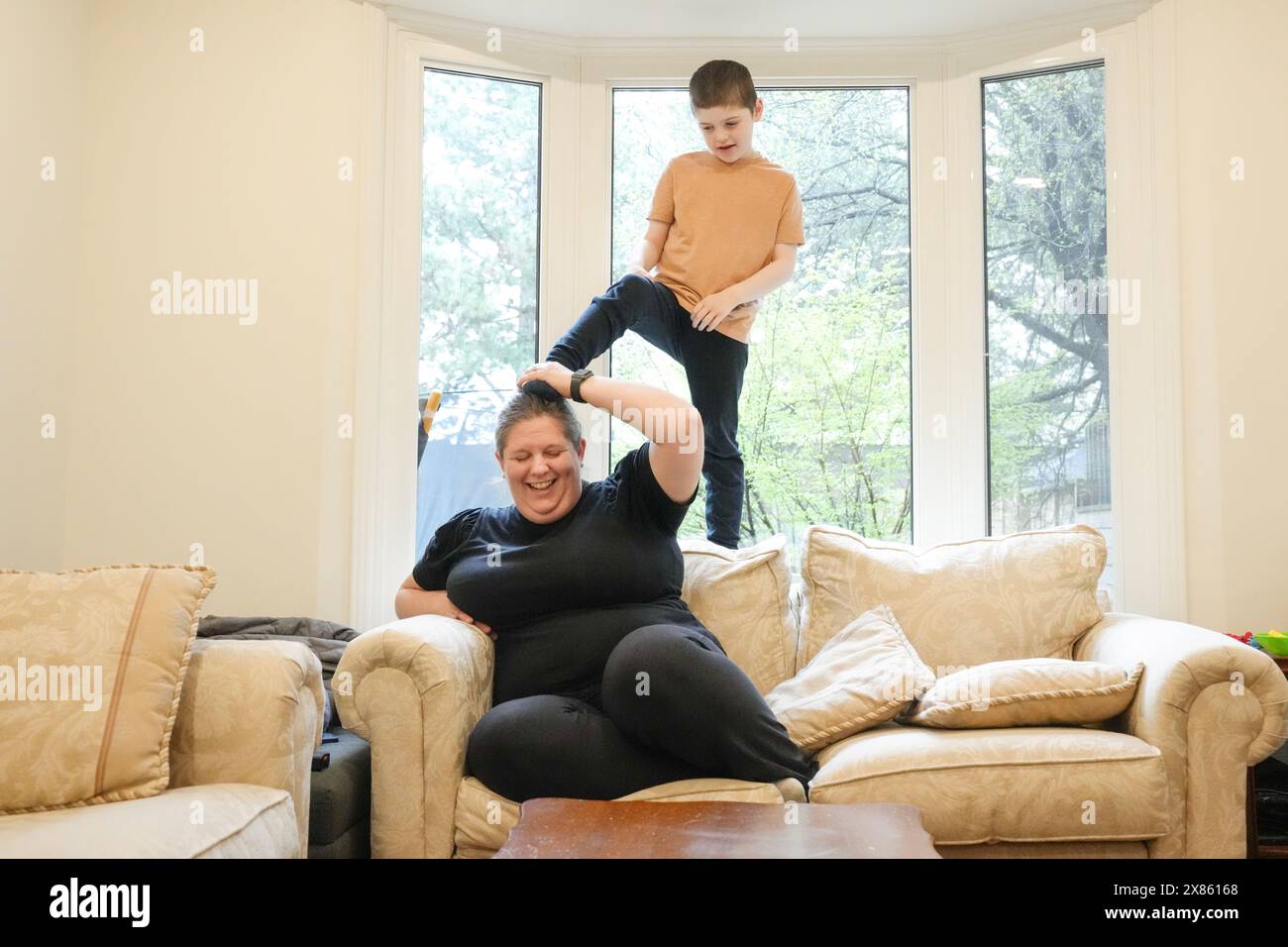 Alexis Wilson is photographed at home with her seven-year-old son ...