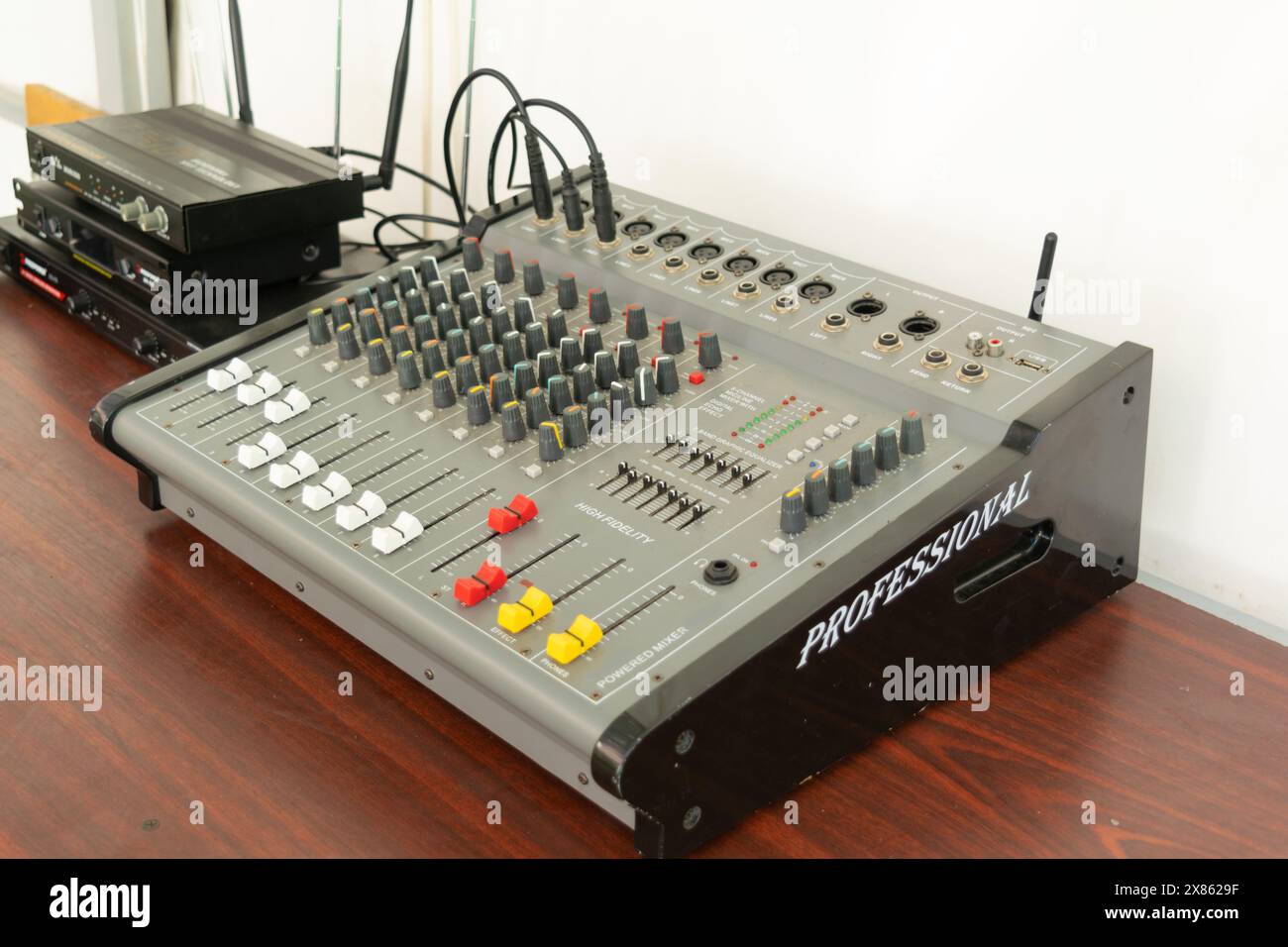 High fidelity audio mixing console with multiple knobs and sliders in a ...
