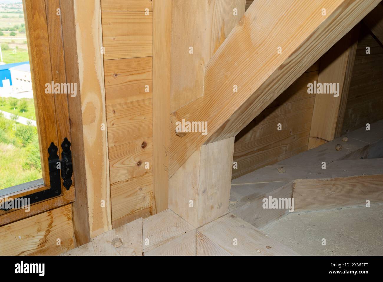 Detailed view of wooden beam structure joint in an architectural ...