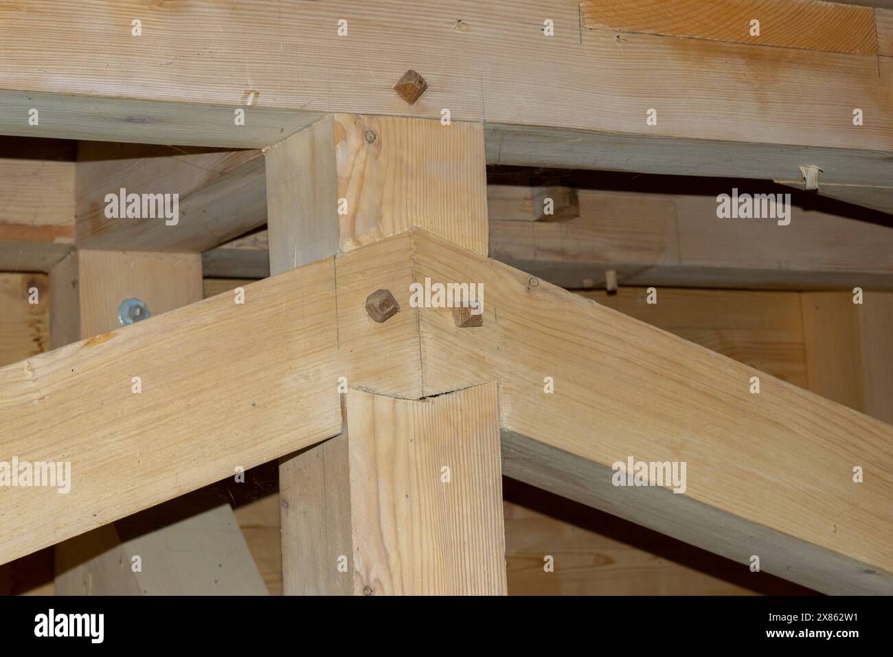 Detailed view of wooden beam structure in an architectural framework ...